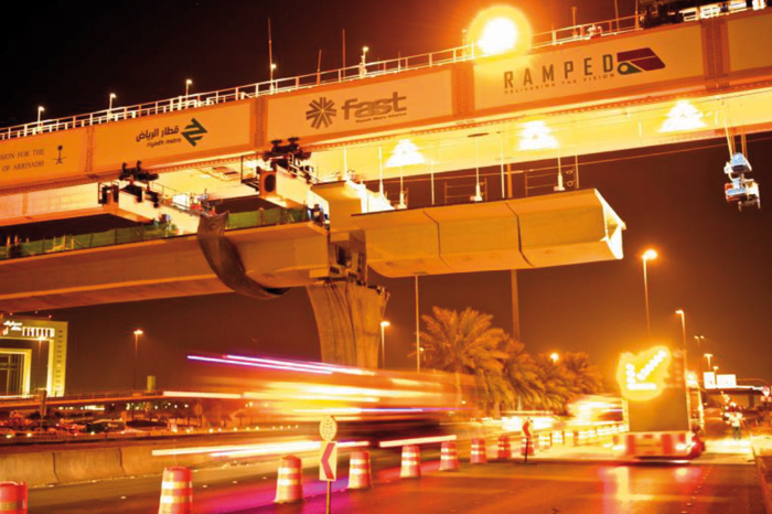 The dynamic nature of construction is captured as trucks pass safely ...